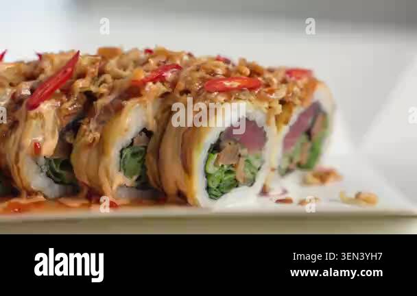 Delicious Japanese sushi roll with fresh tuna, lettuce, and mushrooms ...