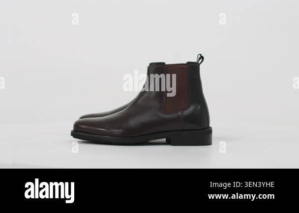 Classic mens ankle boots made from polished dark brown leather. The ...