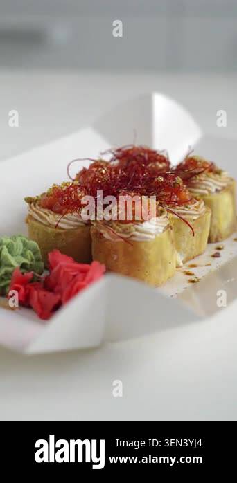 Close-up of a delectable set of sushi rolls with fresh salmon and cream ...