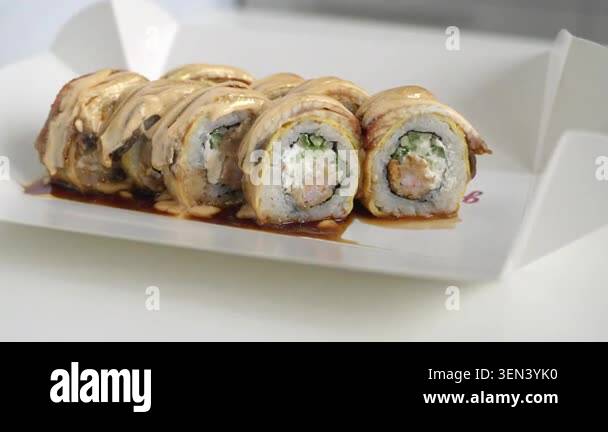 Closeup of a freshly prepared Japanese sushi roll set with eel, shrimp ...
