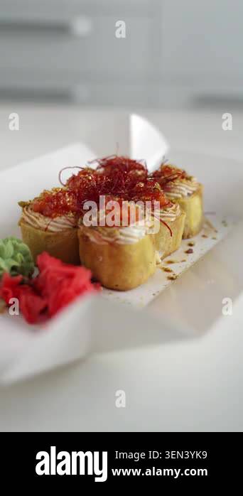 Gourmet set of Japanese fusion sushi rolls with salmon, cream cheese ...