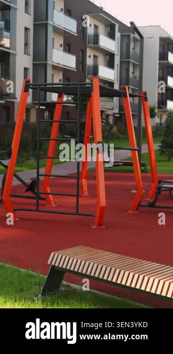 Empty modern outdoor gym in a residential area. Public sports ground ...