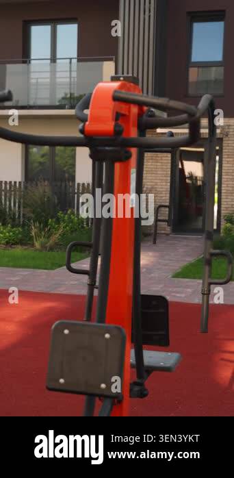 Empty outdoor gym machine operating in a public park. Modern sports ...