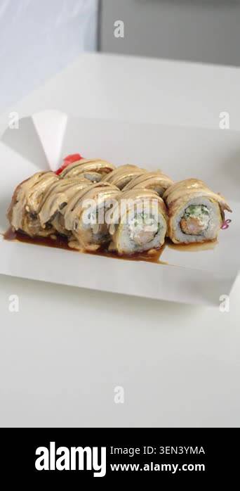 Closeup shot of tasty Japanese sushi rolls with eel, shrimp, cream ...