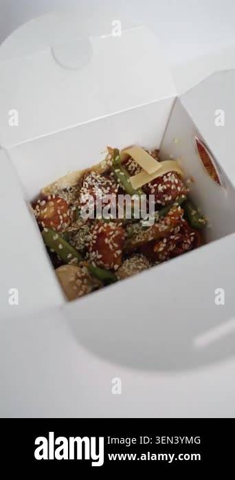 Delicious Asian cuisine with stir-fried noodles, sesame chicken, and ...