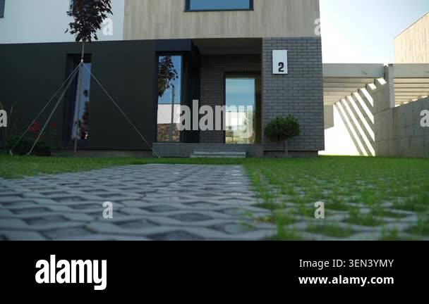 Stunning modern house facade featuring a mix of dark brick, wood ...