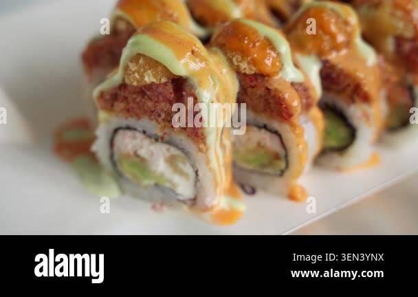 Fresh Japanese sushi rolls with creamy sauce and fish roe. Traditional ...