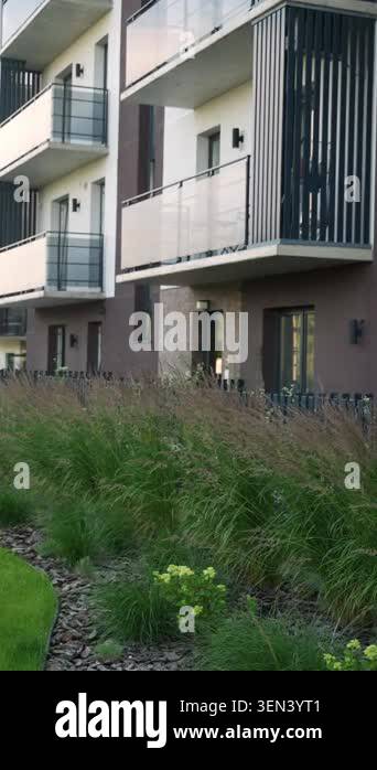 Contemporary residential building facade with balconies and beautiful ...