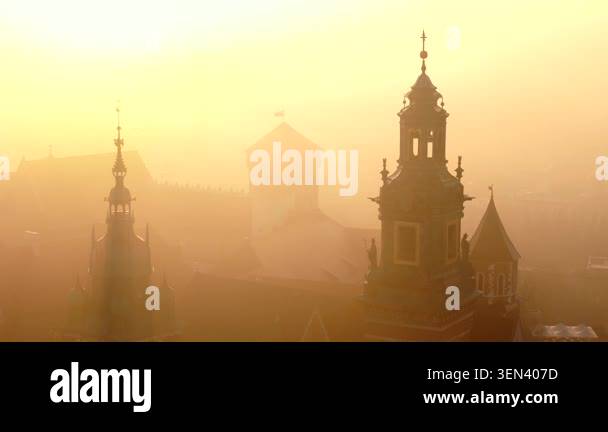 Aerial view of Wawel Castle during foggy sunrise, Cracow, Poland ...