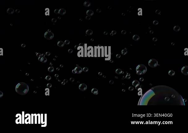 water droplets on black background Stock Video Footage - Alamy
