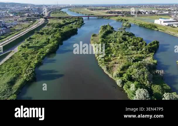 Aerial view of river surrounded by greenery Stock Video Footage - Alamy