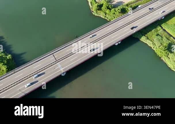 Cars driving over bridge above water Stock Video Footage - Alamy
