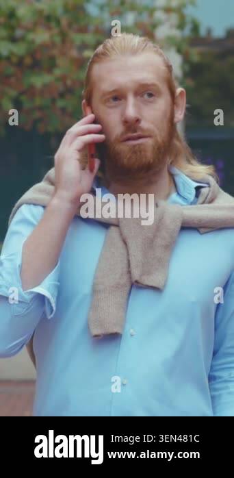 white man outdoor phone call smiling, animated expressions and friendly ...