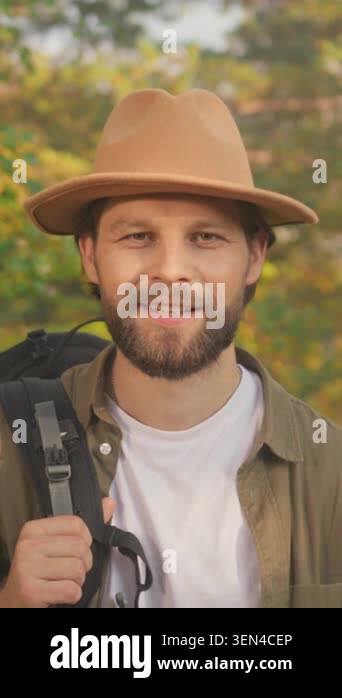 white man hiker in forest smiling, bearded white male wearing tan ...