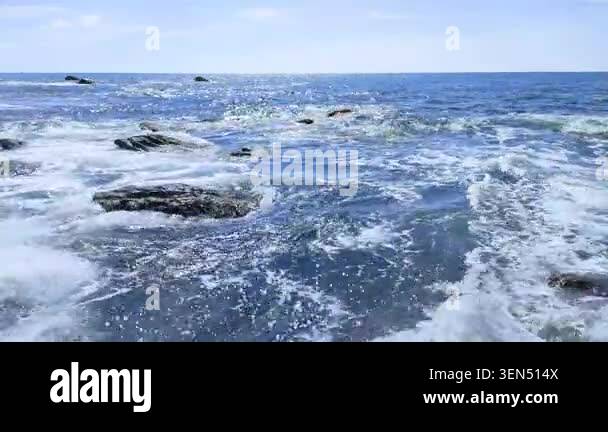 Crashing waves against rocks on the Shonai coast of the Sea of Japan ...