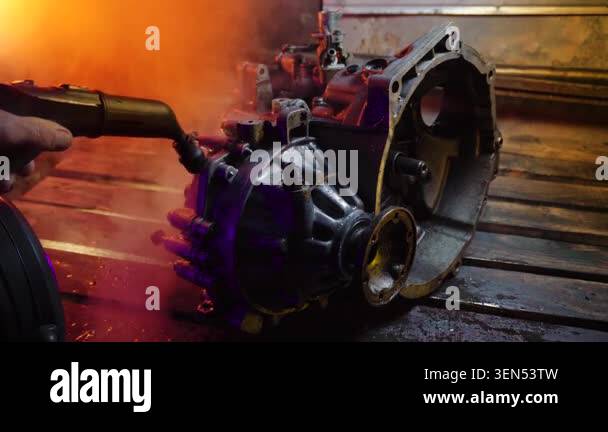cleaning and washing with a steam cleaner of an old manual transmission ...