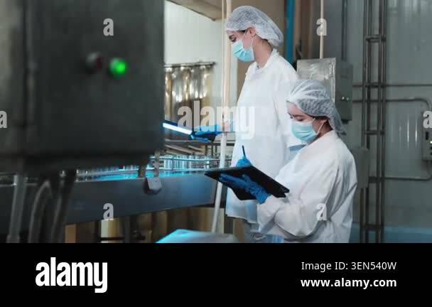Two female industrial engineers inspect and examine quality control ...