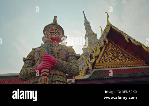 Colorful giant guardian statue at Temple of the Emerald Buddha in ...
