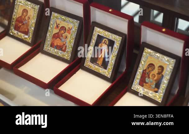 Slow close-up video of framed Christian icons of Jesus, Virgin Mary and ...
