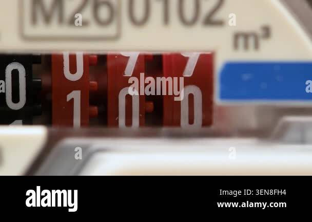 Extreme close-up video of a mechanical water meter counter rolling past ...