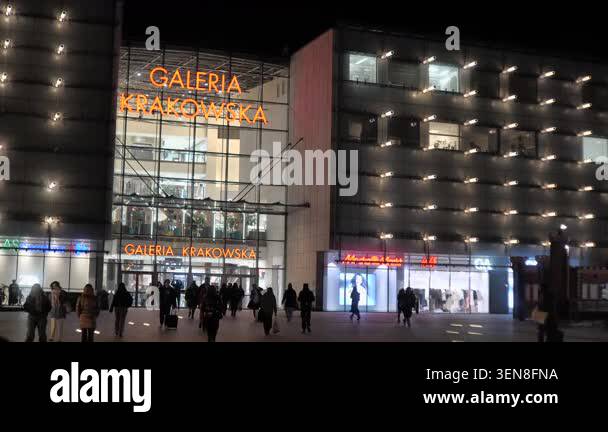 Night exterior video of Galeria Krakowska shopping mall entrance in ...