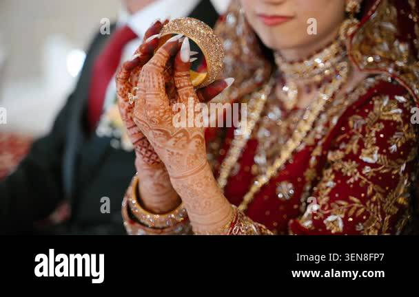 Indian bride holding traditional bridal bangles during wedding ceremony ...