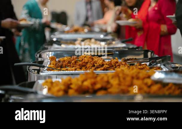 Variety of colorful spiced dished mixed at buffet event. The dish is ...