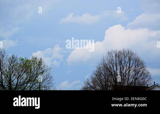 Time lapse of white clouds moving across deep blue sky. High quality 4k ...