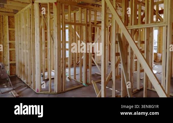 Wood framing inside a new residential house under construction with ...