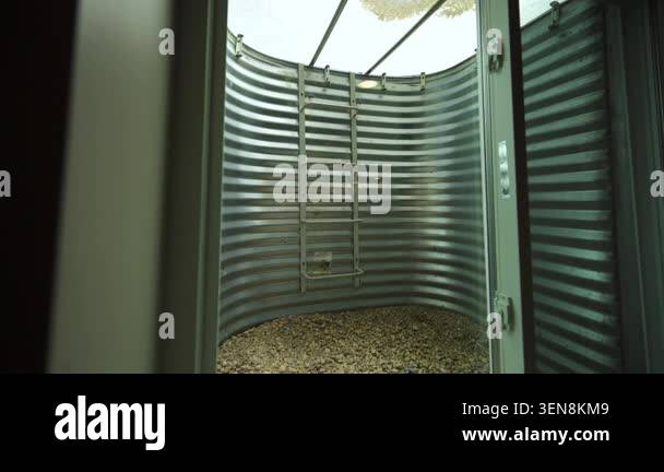 Modern corrugated metal window well attached to residential basement ...