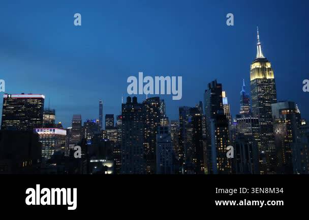 timelapse of the empire state building and midtown manhattan at night ...