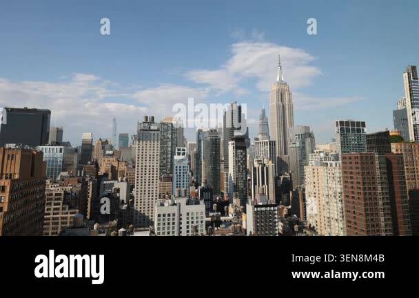 Dramatic clouds moving over the New York skyline and the empire state ...