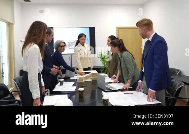 Professional diverse team of architects and business leaders discussing ...