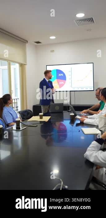 Professional medical staff in a conference room attending a ...