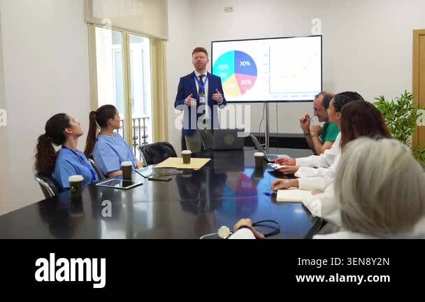 Diverse group of doctors and nurses attending a medical conference. A ...