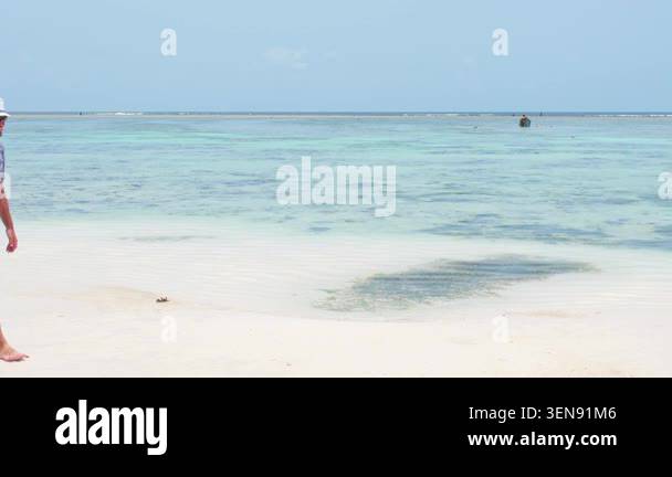 Couple man woman stand together hugging hold hands on white sand beach ...