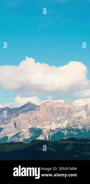 Timelapse Dolomites mountain range Italy jagged peaks moving clouds ...