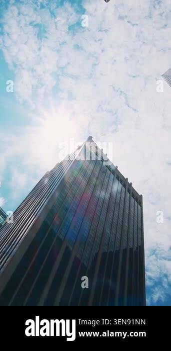 Timelapse Modern three skyscrapers glass facade buildings with sun ...