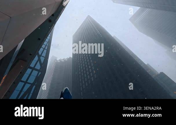 Looking at the sky during the snow blizzard. Snowflakes fall among the ...