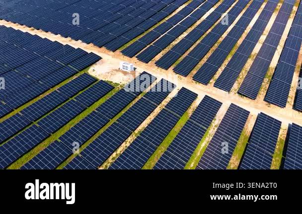 Numerous rows of modern photovoltaic cells. Production of green energy ...