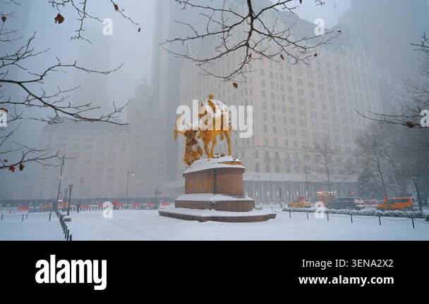 Snow covers the William Tecumseh Sherman Monument and the square around ...