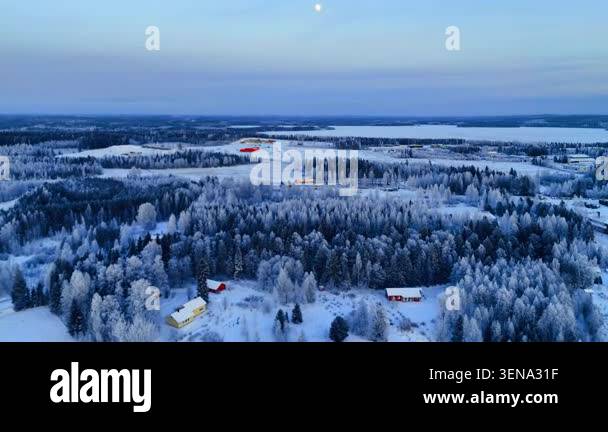 Small town surrounded by frost covered forest, Lapland, Finland ...