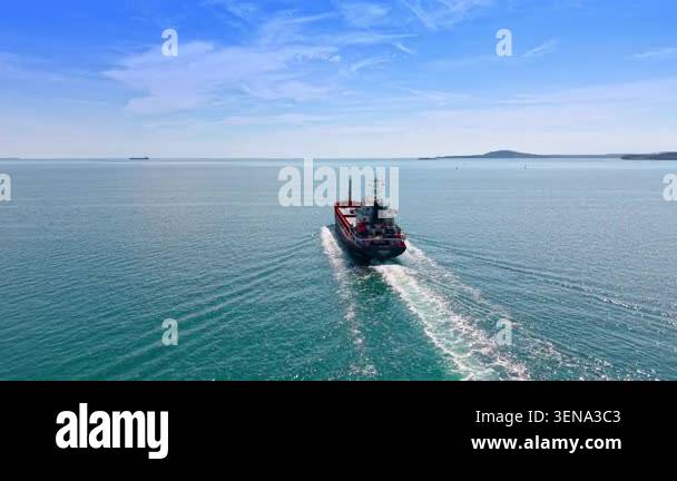 Following a large ship moving by the beautiful waterscape. Vessel ...