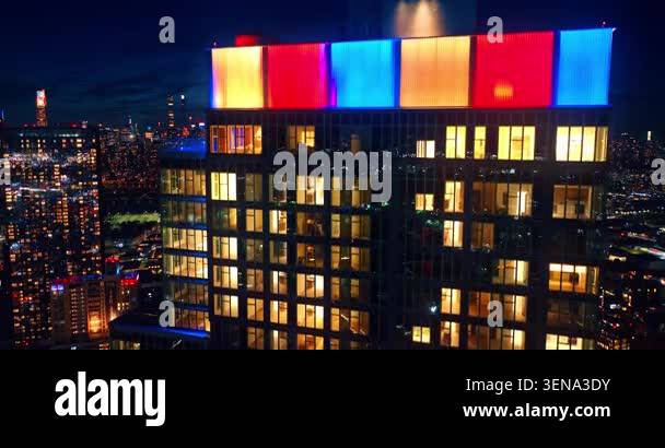 Rising to the top of the high-rise with colorful light panels ...