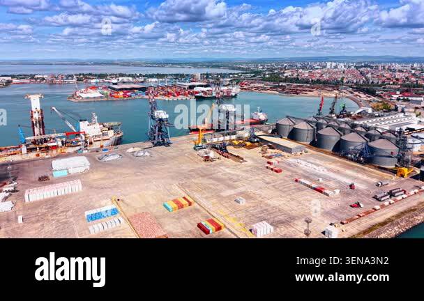 Flight over a few groups of containers in the open area of the port ...
