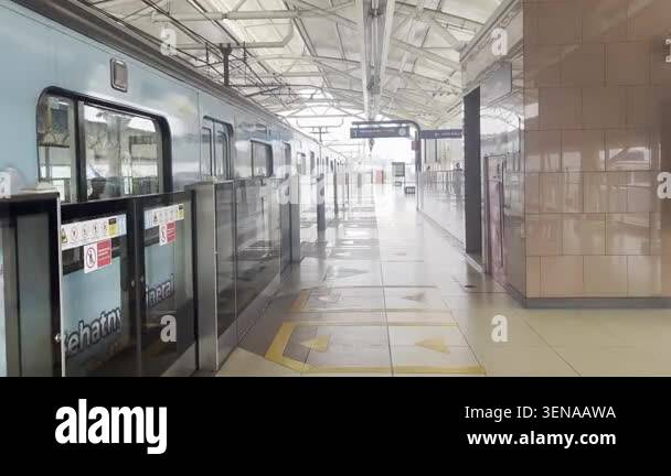 Clean, static wide shot showcasing the interior of an empty subway or ...