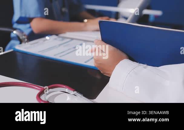 female doctor holding a folder in hospital background Stock Video ...