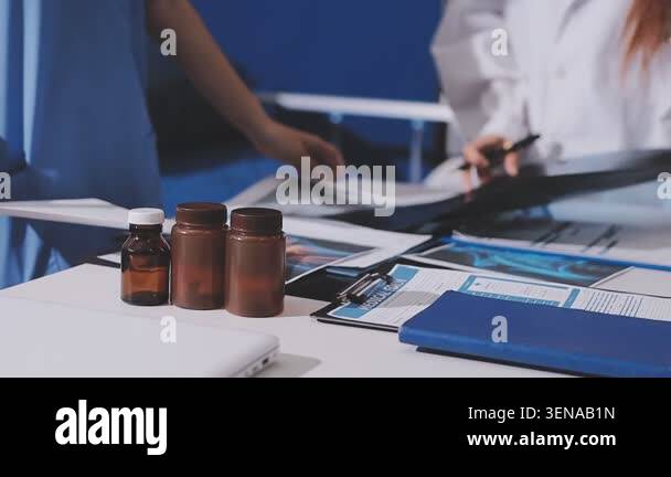 close up of a medical doctor holding a clipboard in the background ...
