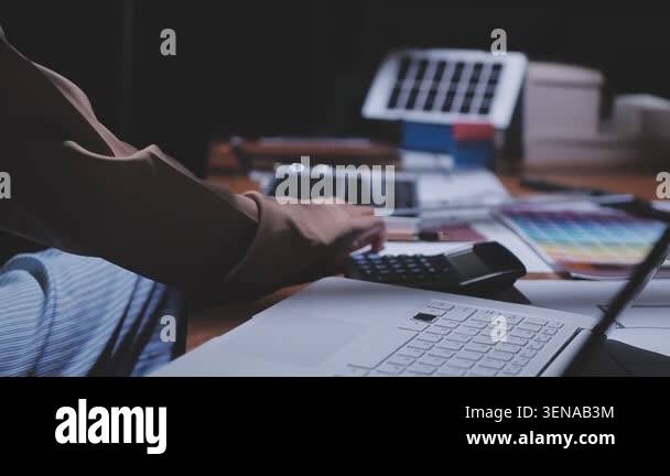 business man with calculator working on laptop Stock Video Footage - Alamy