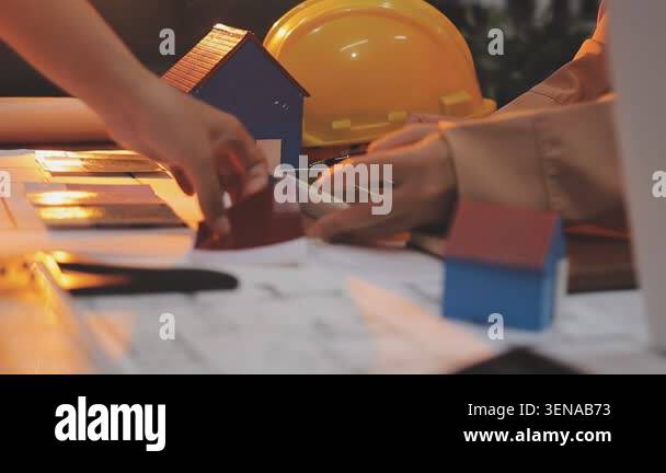engineer or architect working on blueprint at office building site with ...